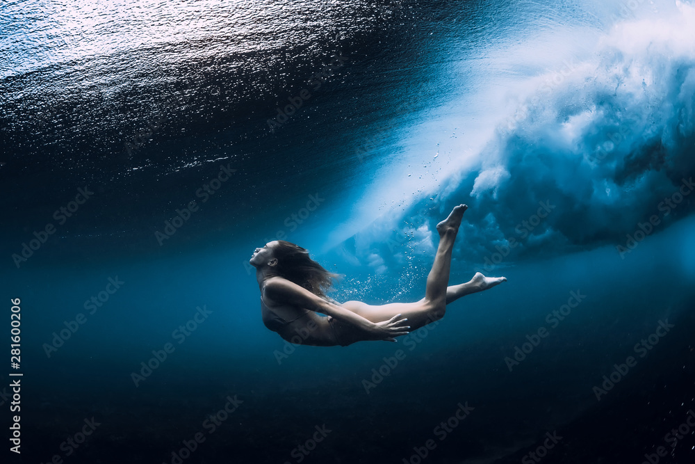 Zdjęcie Stock Woman Swim Underwater With Ocean Wave Adobe Stock
