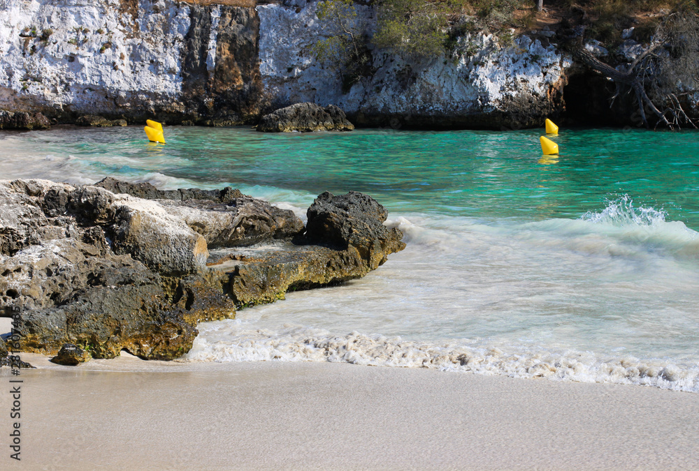 Sea water, white sand and white rocks of Cala Turqueta beach, Menorca ...