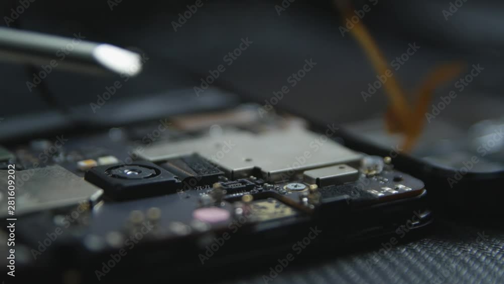 Close-up shot showing the process of cell phone repairing. Hands of ...