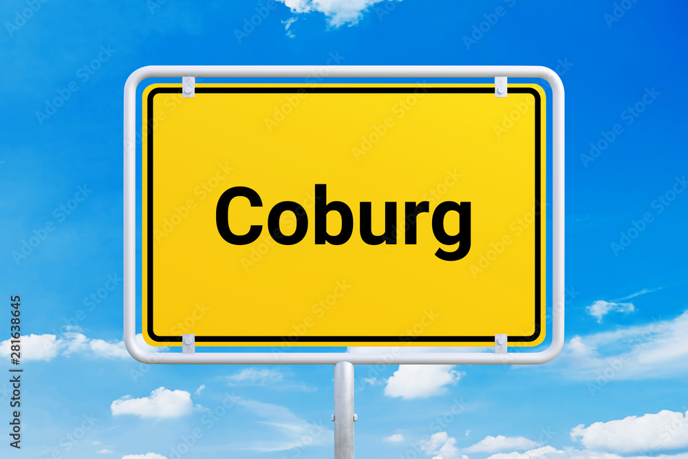 Stadt Coburg. Gelbes Schild, Ortsschild, Ortseingangsschild. Himmel mit ...