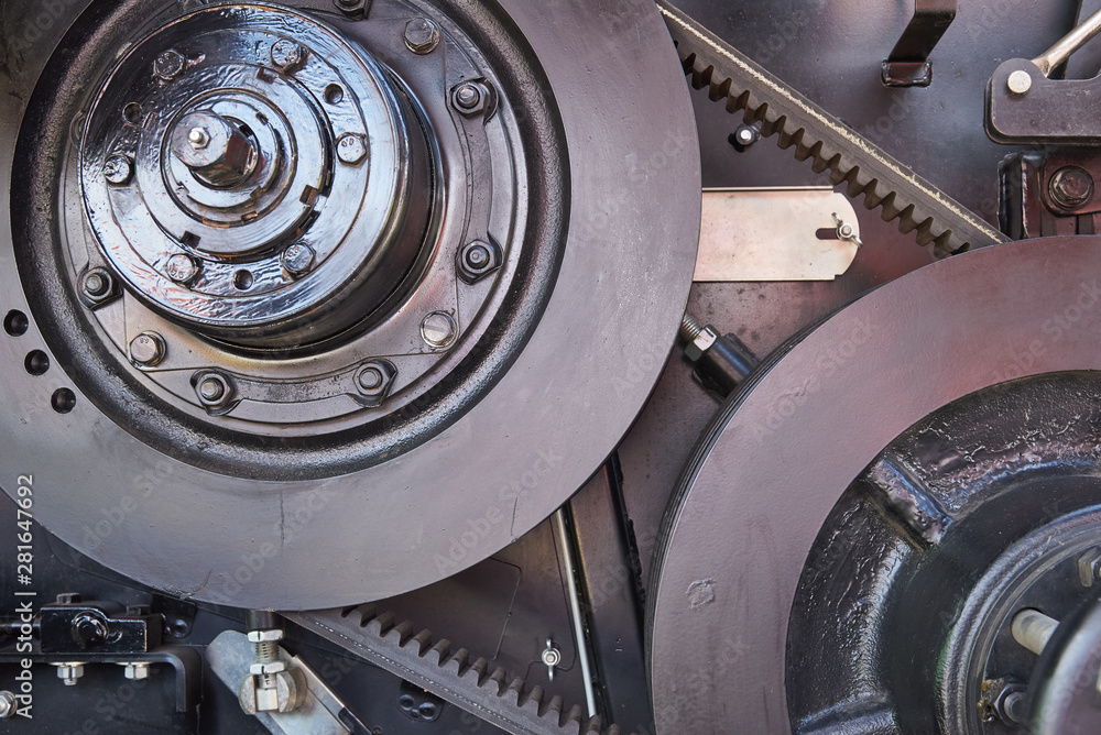 Belt drive with automatic belt tensioning mechanism. Fragment of a ...