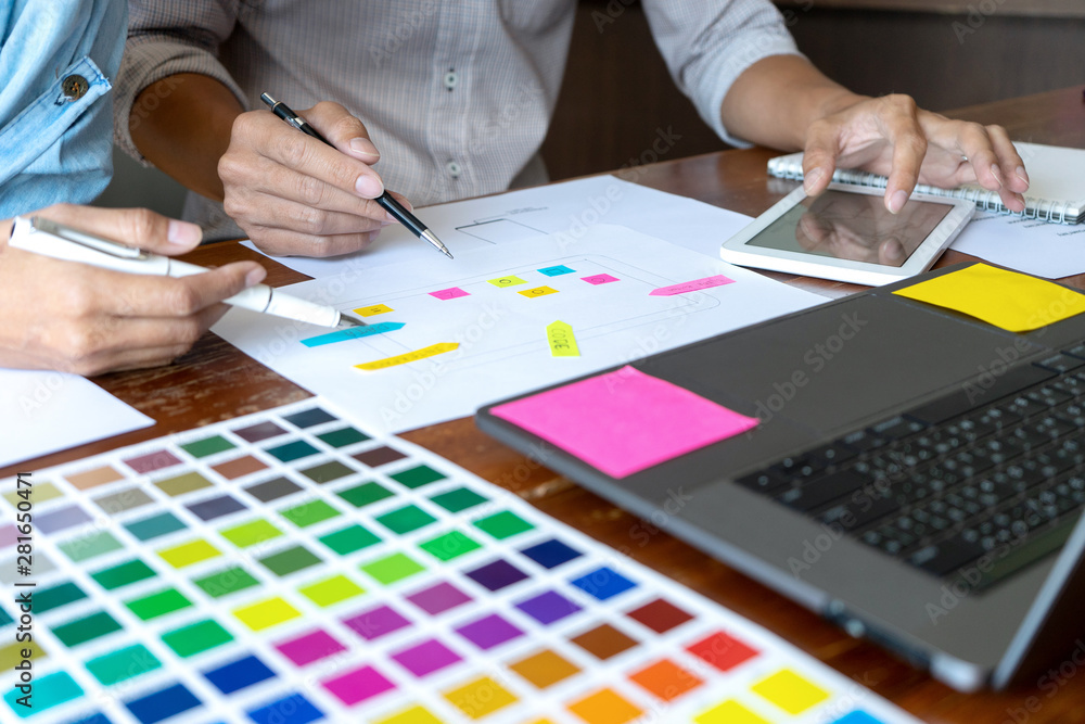 Group of young designer working in the office to design a new product ...