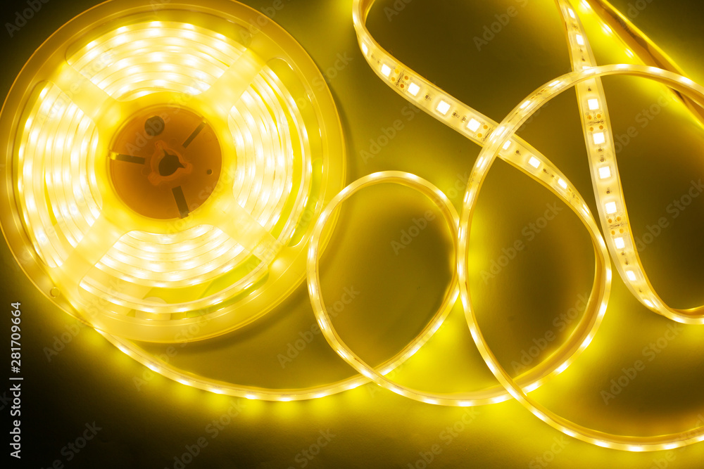 bright yellow LED strip, diode strip, a coil of silicone strip Stock ...