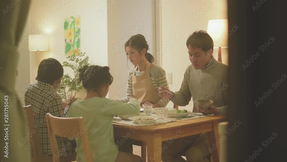 Family Talking At Dinner Table