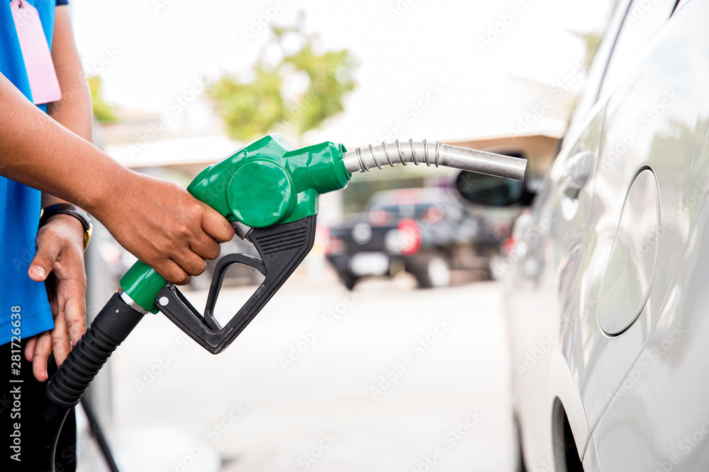 Man Refill and filling Oil Gas Fuel at station.Gas station - refueling ...
