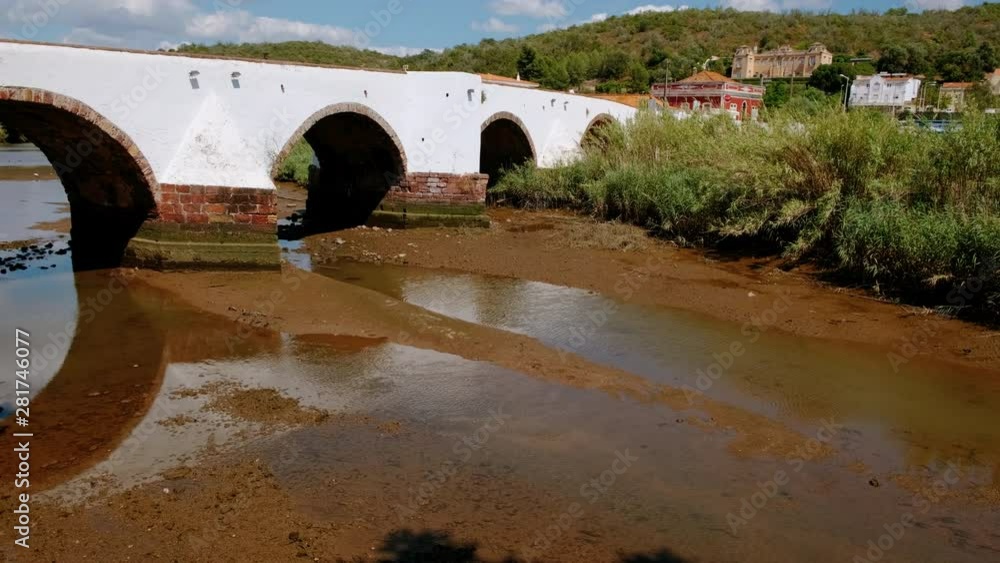 The Roman bridge of Silves over the Arade river in the Algarve ...