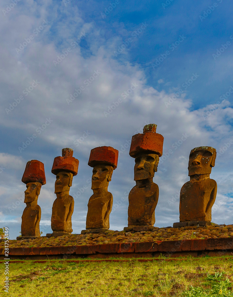 Moai on Easter Island with red topknot hats at Anakena Ahu. Stock Photo ...