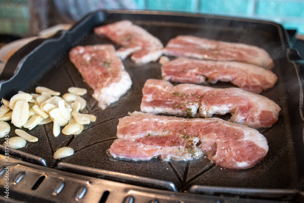 Korean style barbeque Samgyeopsal with garlic Stock Photo | Adobe Stock