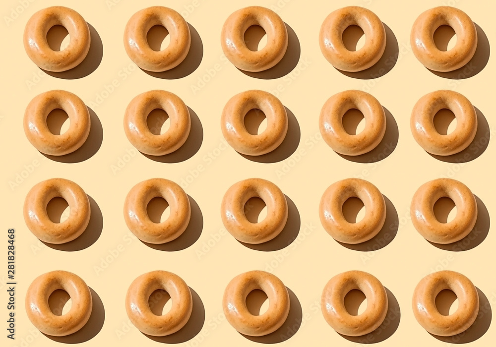 Bagels pattern on a peach color background . Bakery product template ...