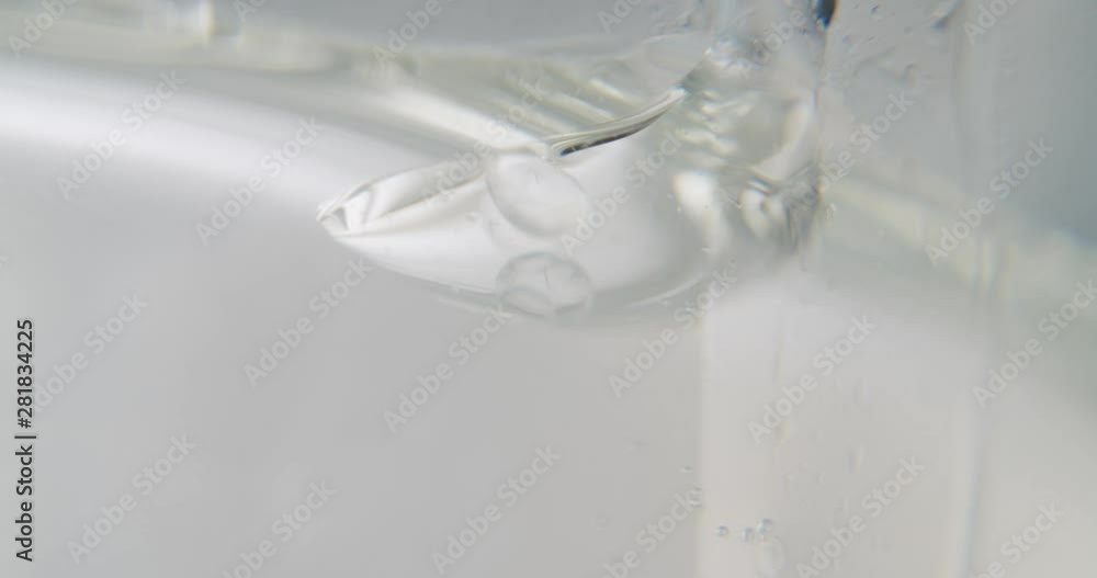 Liquid viscous substance mixed with water in chemistry lession. Water ...