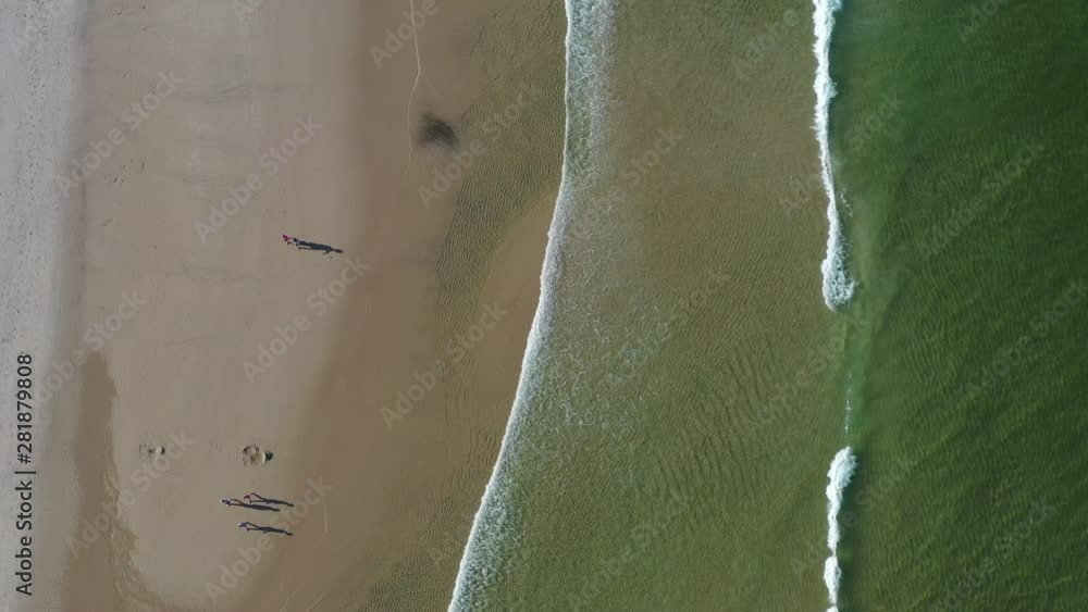 The nutrient-rich waters of the Atlantic Ocean bathe a scenic beach on ...