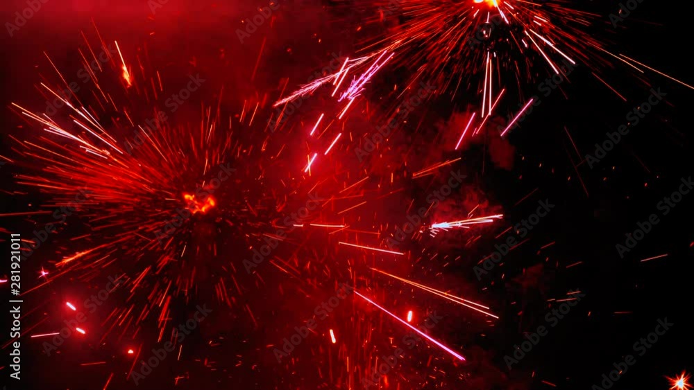 Sparkling red fireworks on black background during celebrating holiday ...