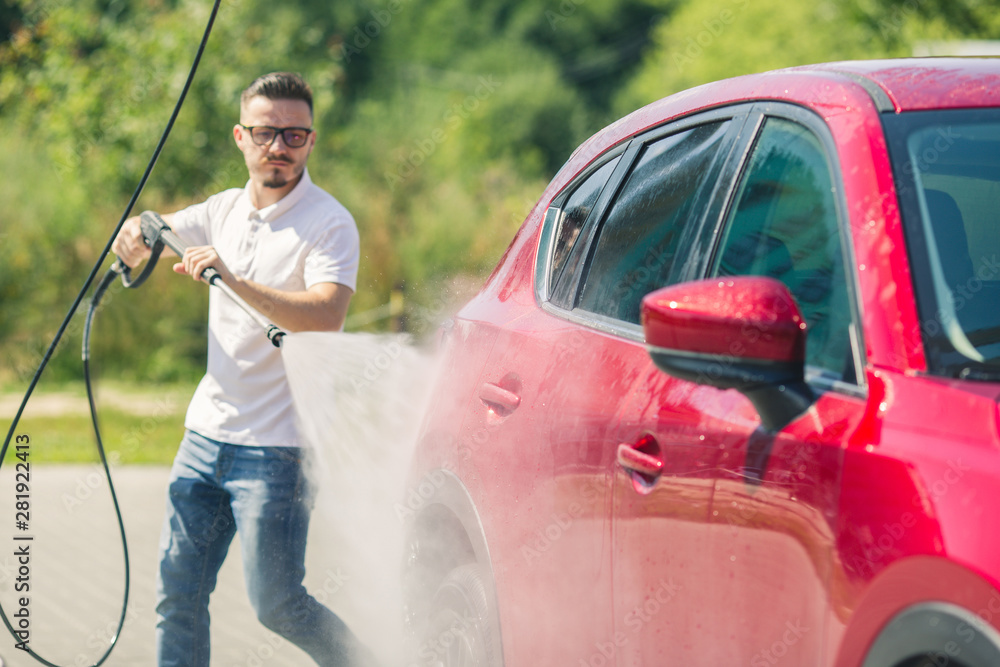 Manual car wash with pressurized water in car wash outside. Summer Car ...