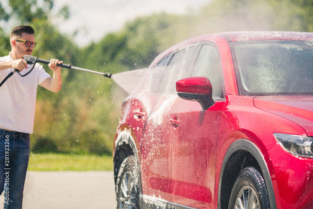 Manual car wash with pressurized water in car wash outside. Summer Car ...