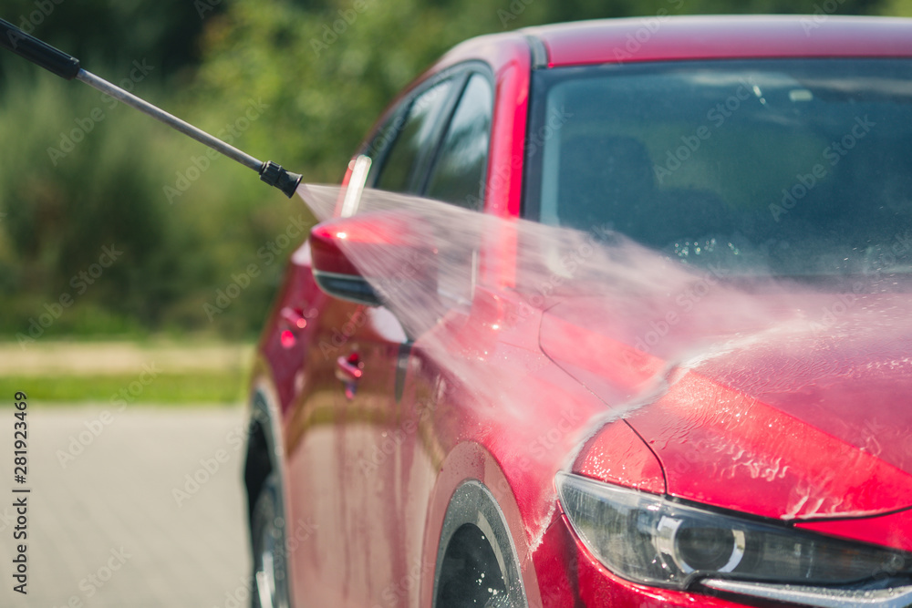 Manual car wash with pressurized water in car wash outside. Summer Car ...