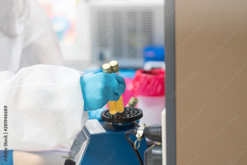 Laboratory technician use vortex mixer to mix Brain heart infusion (BHI ...