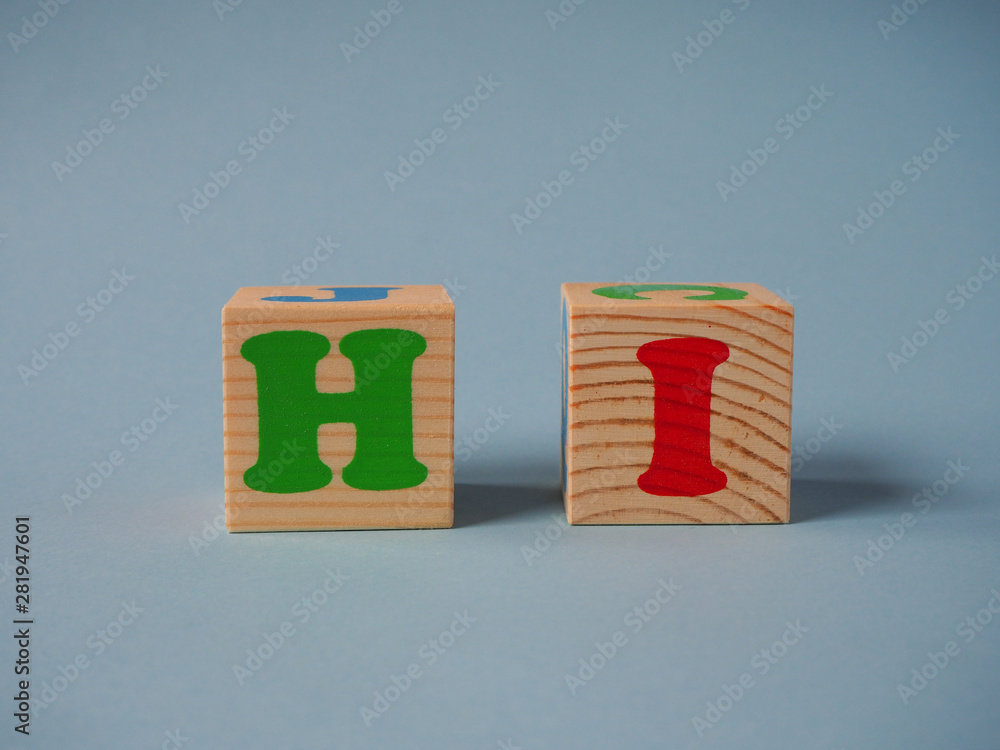 Wooden alphabet ABC toy blocks with the text: hi. Isolated kids ...