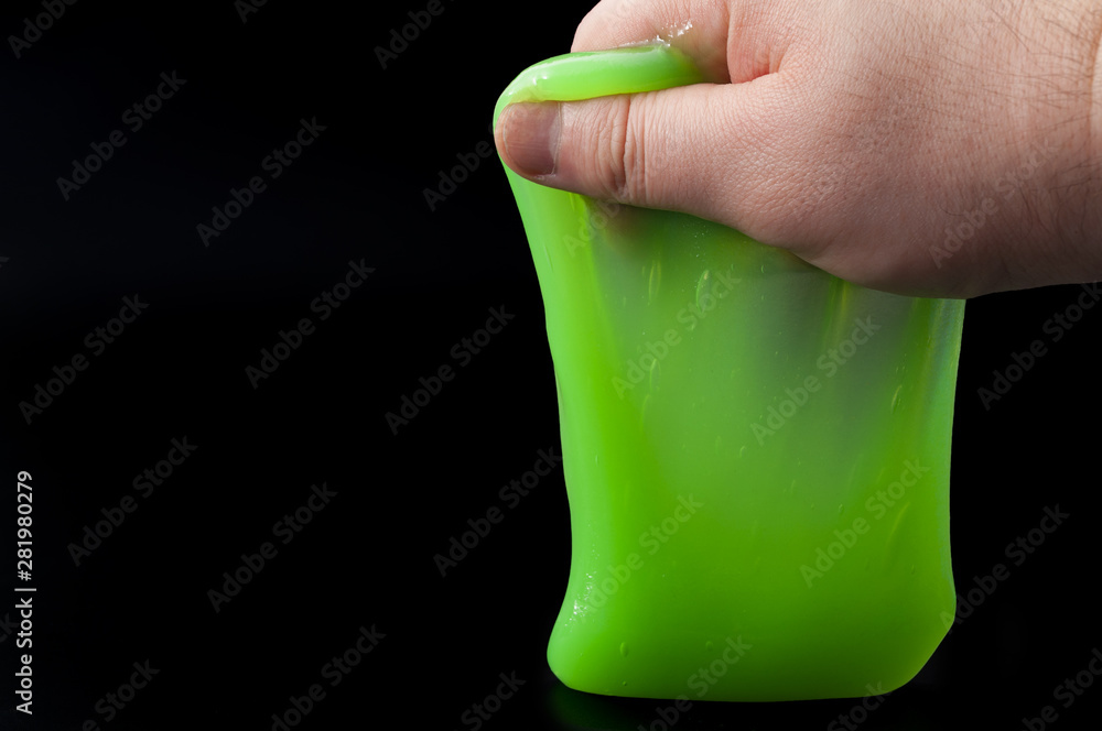 Gross science and squishy toy concept theme with hands playing with ...