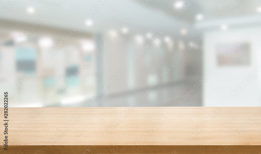Wood table in modern hospital interior with empty copy space on the ...