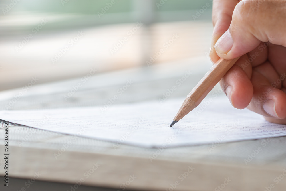 Student hand testing doing test exam with pencil drawing selected ...