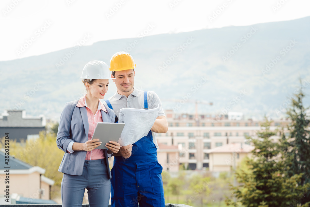 Architect and builder developing ideas for construction project Stock ...