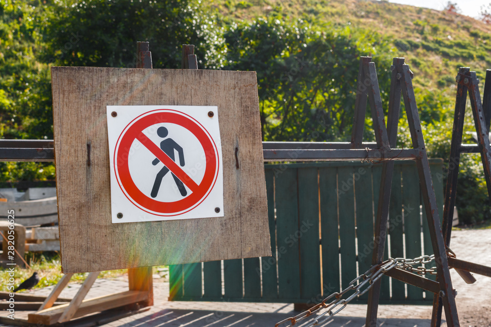 pedestrian traffic is prohibited on a black iron fence. ban on the ...