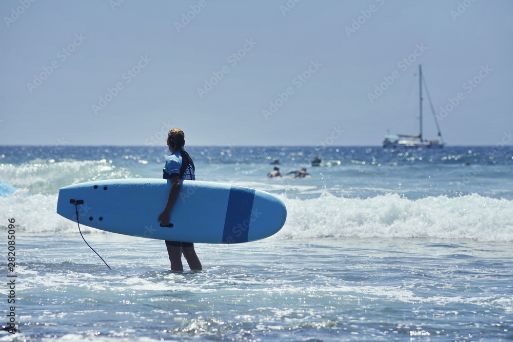 Young pro surfer surfs a big barrel wave in popular surf spot in ...