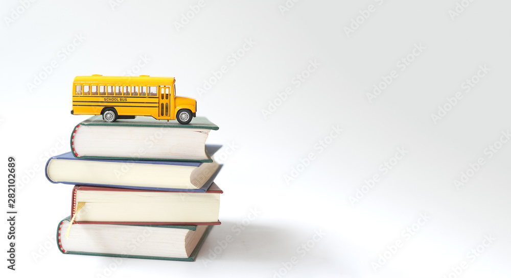 Yellow school bus with books, back to school concept, school ride to ...
