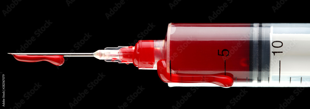 Syringe filled with blood and dripping from the needle - isolated on ...