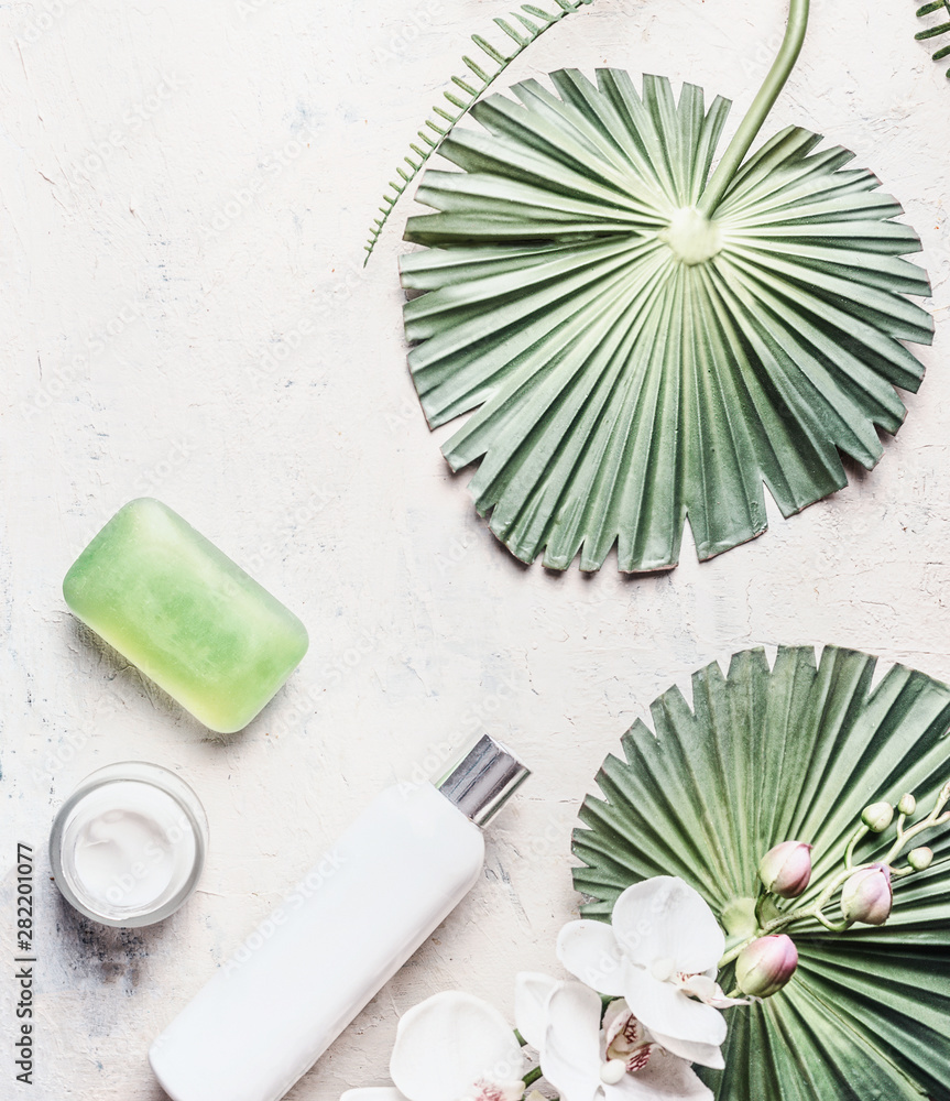 Natural skin care products: bottles, soap and cream on light background ...