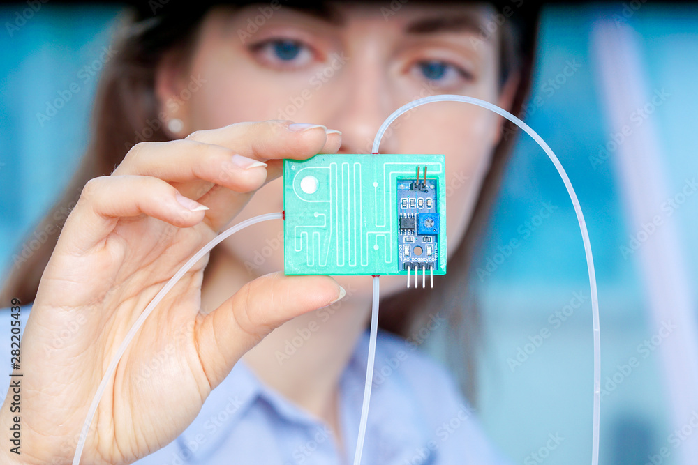 Girl holding polymers Bio-MEMS biomedical microelectromechanical ...