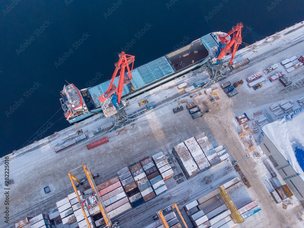Commercial north arctic port is loading containers onto cargo tanker ...