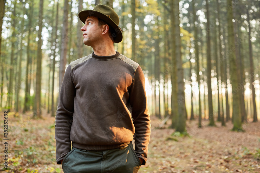 Man as a forester or forestry worker in the forest Stock Photo | Adobe ...