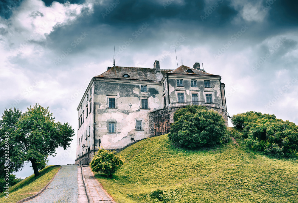 Beautiful old castle on a cloudy sky background. Ukraine. Olesky castle ...
