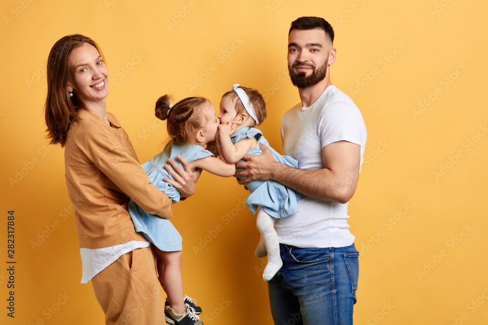 young couple having fun with cute children . Mother's Day love family ...