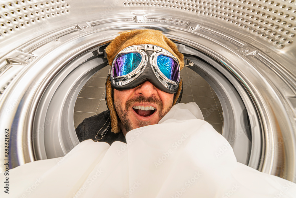 washing machine and spin. Man with aviator glasses, quick wash concept ...