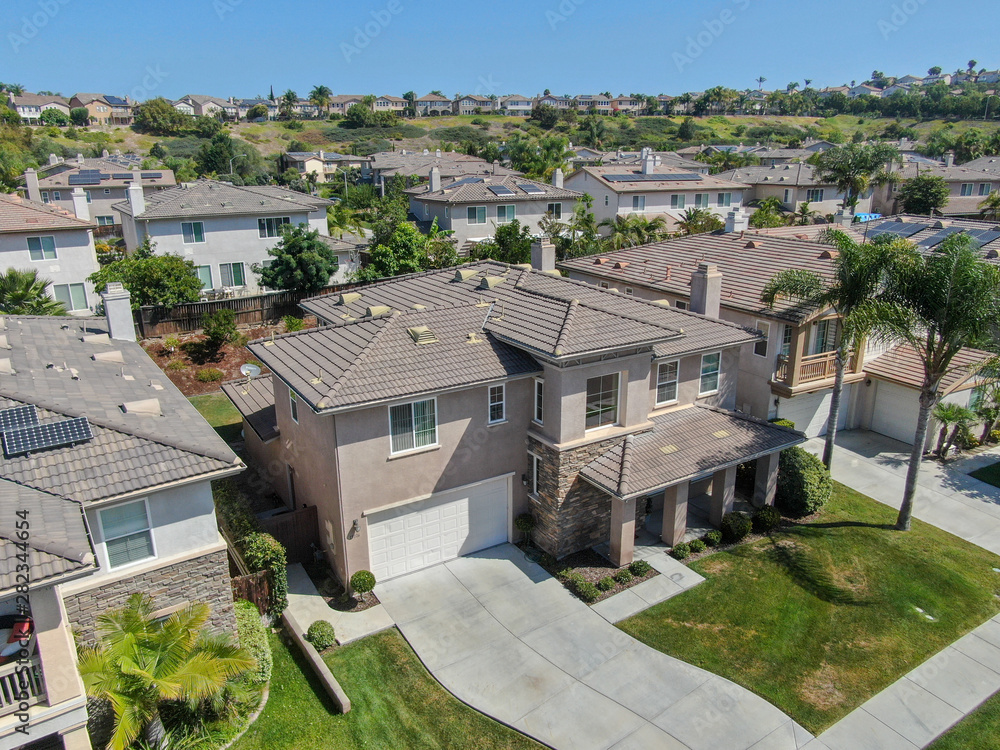 Suburban neighborhood street with big villas next to each other in ...