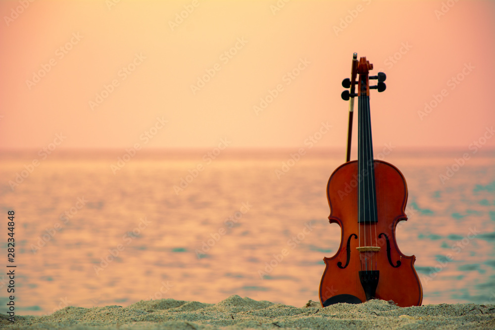Close up of a Violin at the beach with sunset background Stock Photo ...
