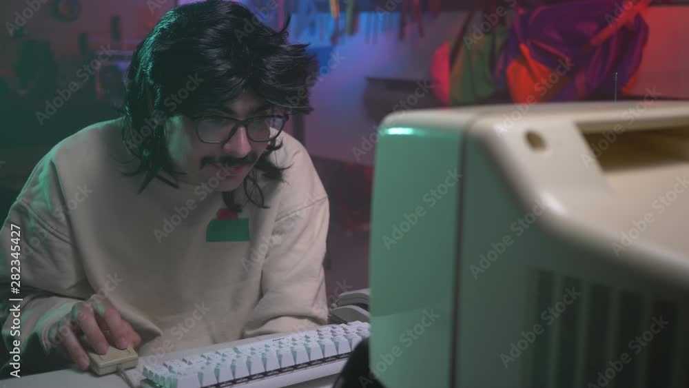 Computer nerd from the '80s or '90s using a mouse. Retro scene with ...