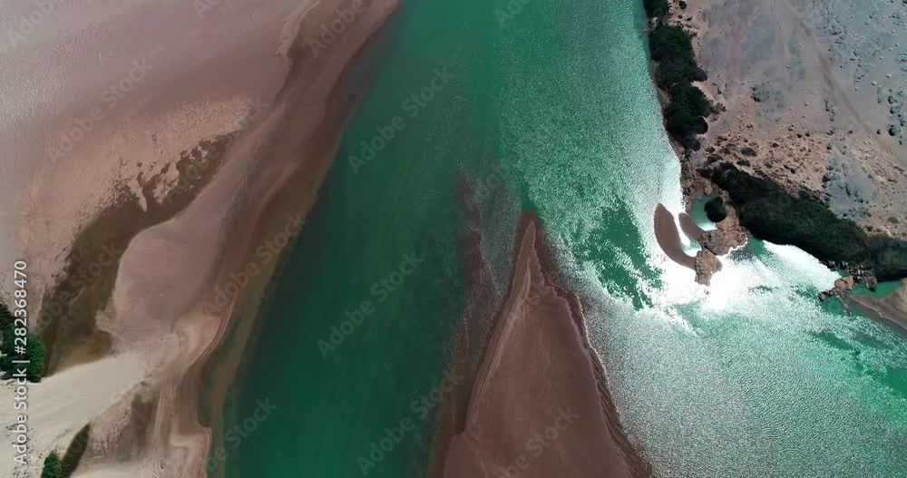 Arial birds eye view of the majestic and peaceful Kunene River on the ...
