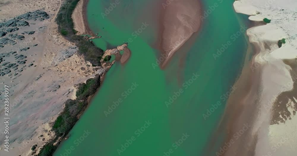 Arial birds eye view of the majestic and peaceful Kunene River on the ...
