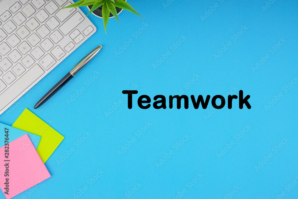 Flat lay, top view office table desk. Workspace with TEAMWORK ...