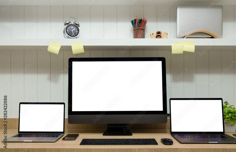 Mockup image of three computers with blank white screen background on ...