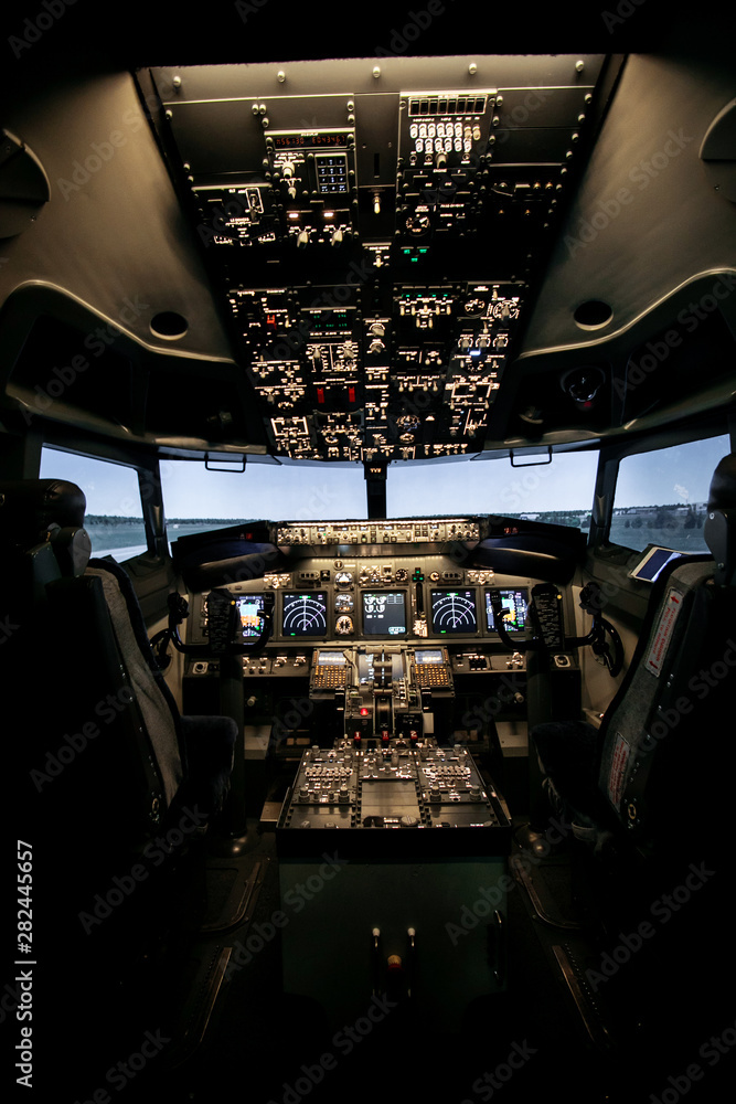Aircraft interior, cockpit view inside the airliner. Point of view from ...