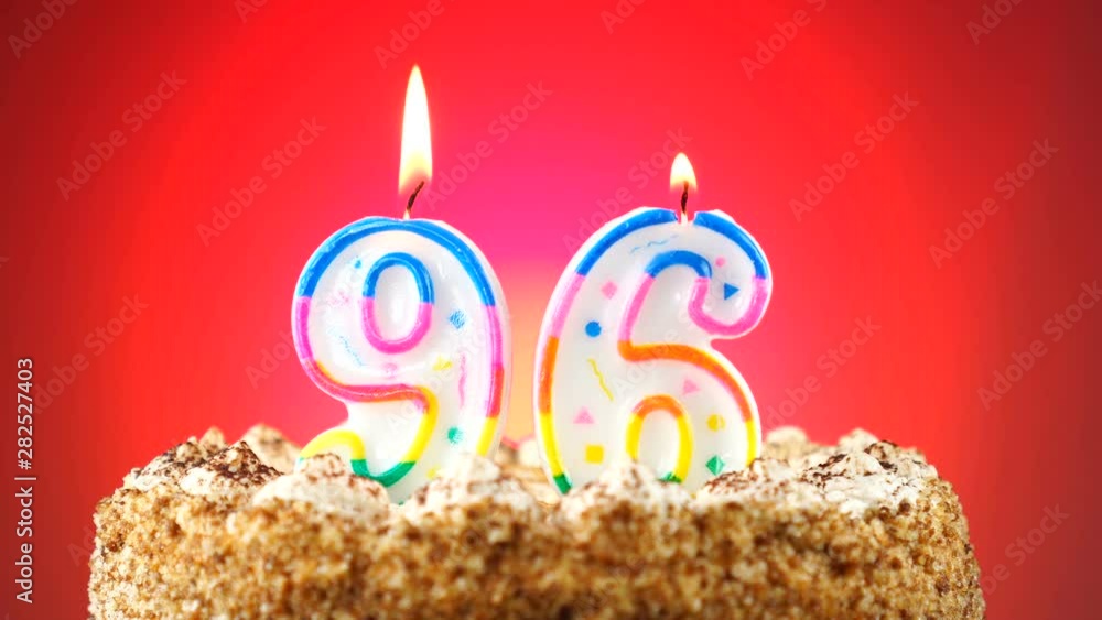 Birthday cake with a burning birthday candle. Number 96. Background ...