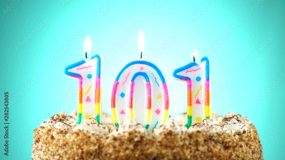 Birthday cake with a burning birthday candle. Number 101. Background ...