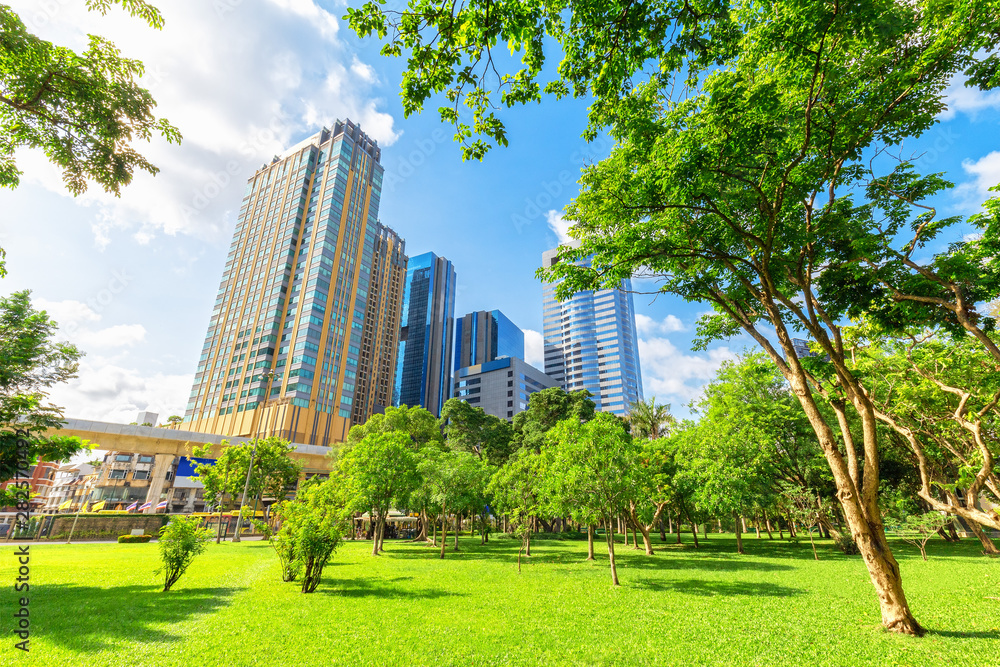 The park has green nature. With an office building background Stock ...