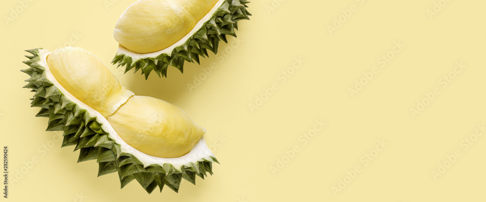Fresh cut durian on a pastel yellow background, king of fruit from ...