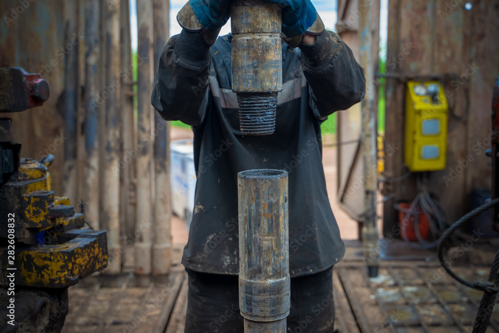 Offshore oil rig worker prepare tool and equipment for perforation oil ...