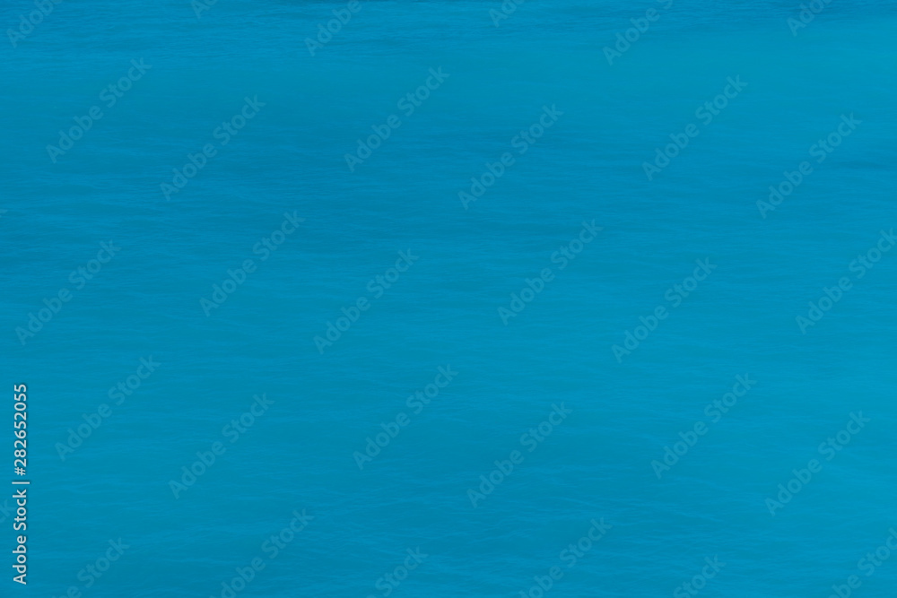 Sea surface. Blue background. Azure sea. Azure and turquoise backgrond ...